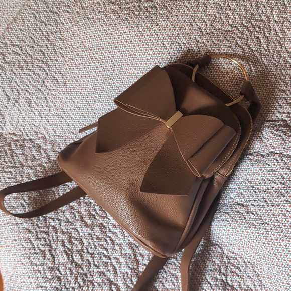 Crossi | Bags | Crossi New York Faux Pebbled Leather Backpack Purse Bow ...